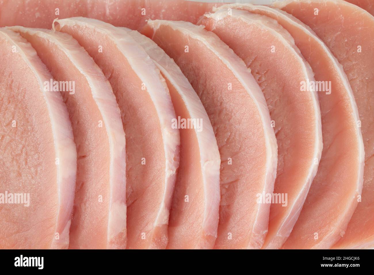 raw pork pieces isolated on white background Stock Photo - Alamy