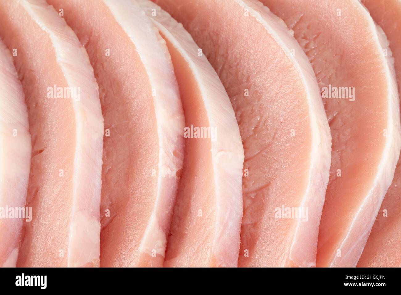 raw pork pieces isolated on white background Stock Photo - Alamy