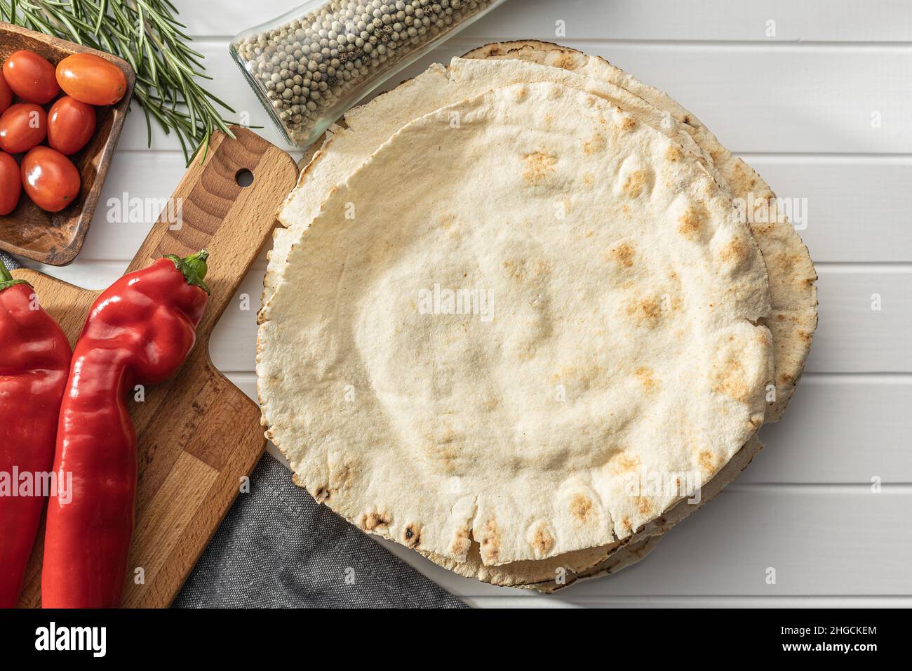Arabic bread. Flat pita bread on white table. Top view Stock Photo - Alamy
