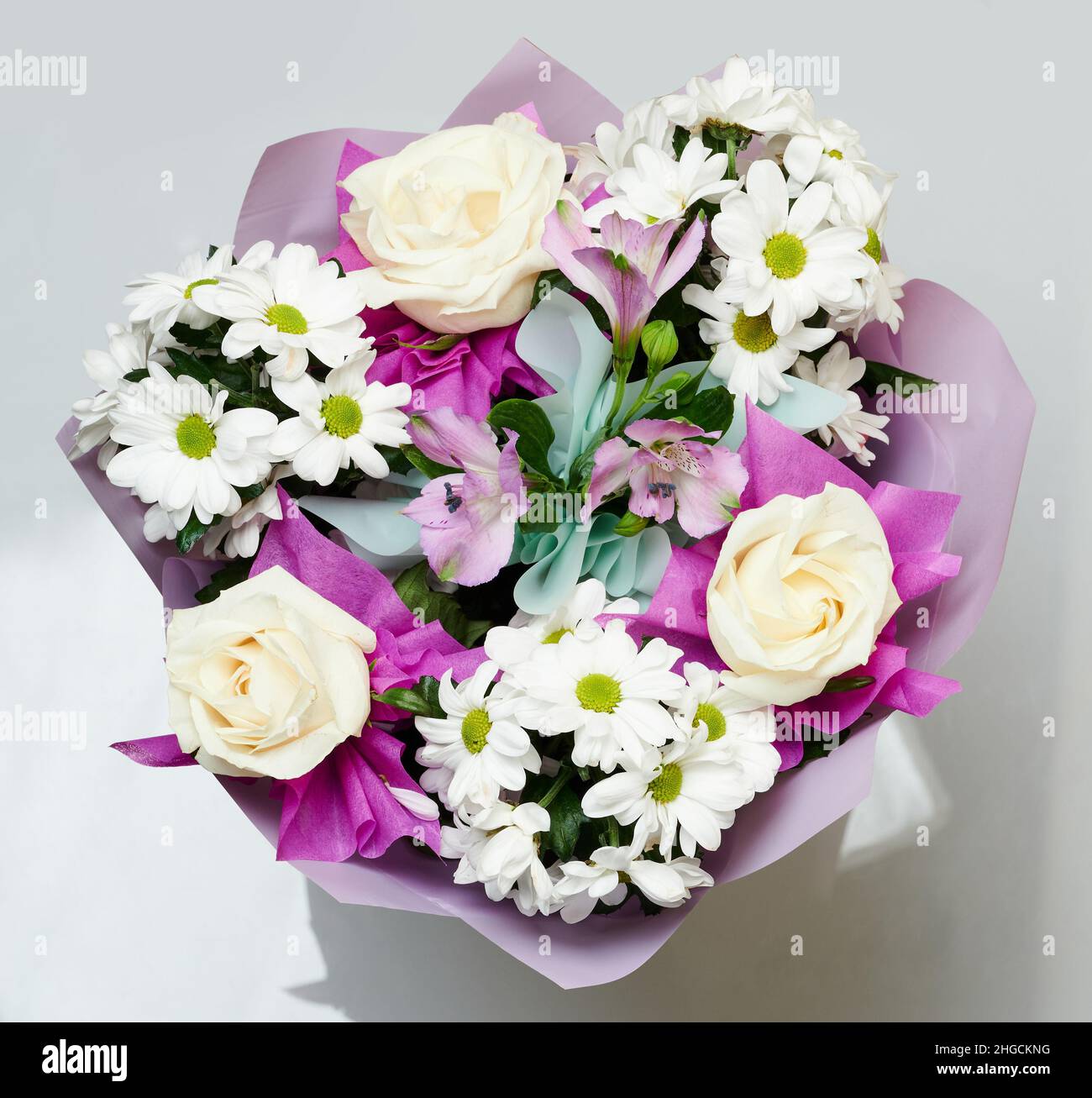 Purple color flowers bouquet above top view isolated Stock Photo - Alamy