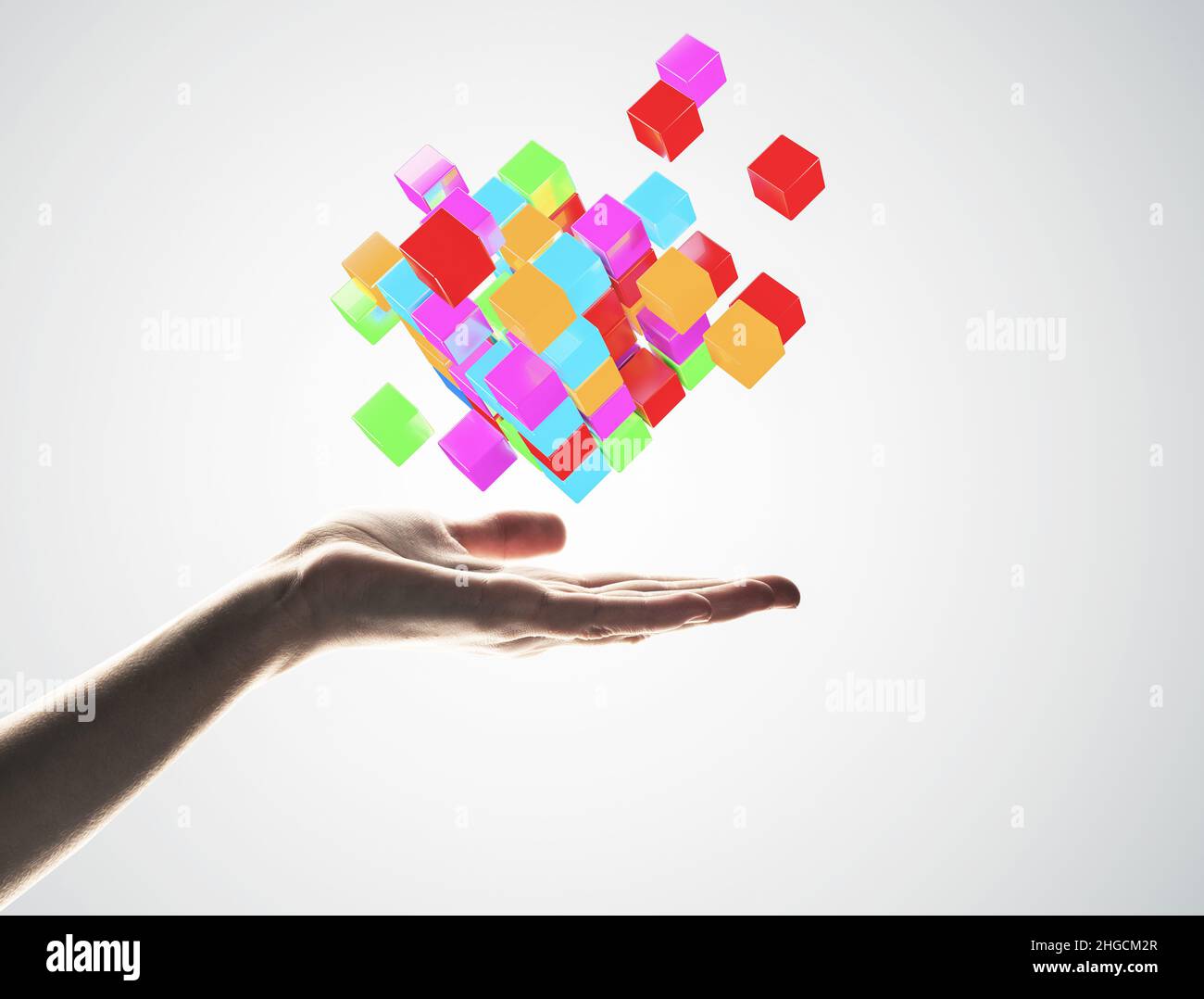 Cube color figure in male palm as symbol for integration. 3D rendering ...