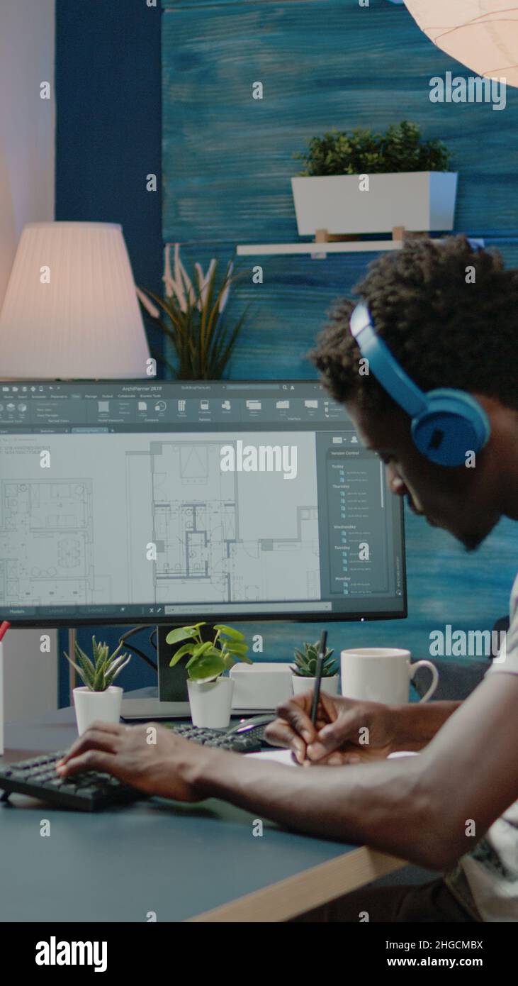 Person working with sketch of blueprint plan on computer to create ...