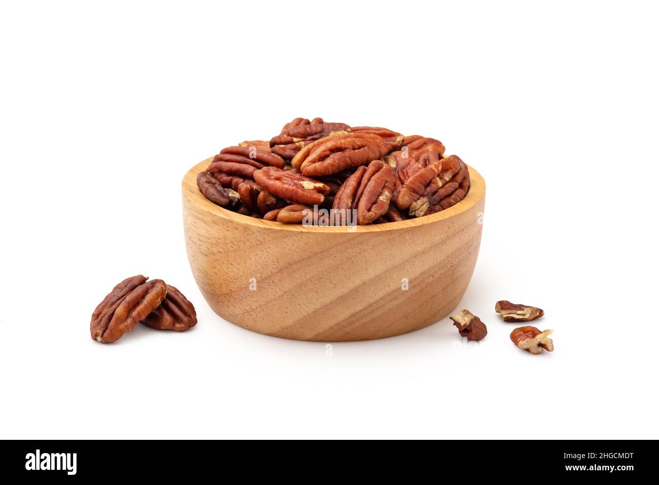 Pecans in wood bowl isolated on white background Stock Photo - Alamy