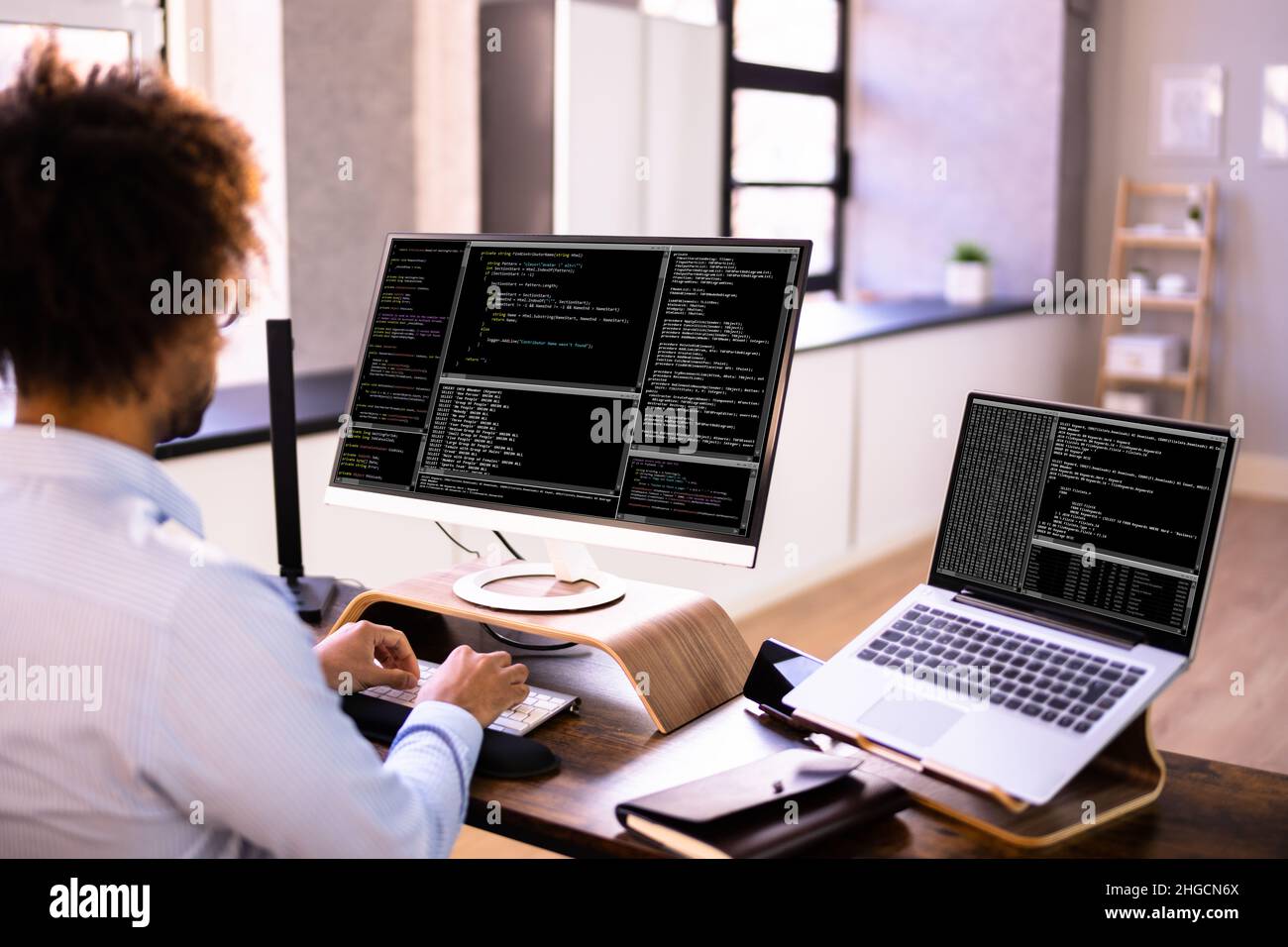 African American Coder Using Computer At Desk. Web Developer Stock Photo - Alamy