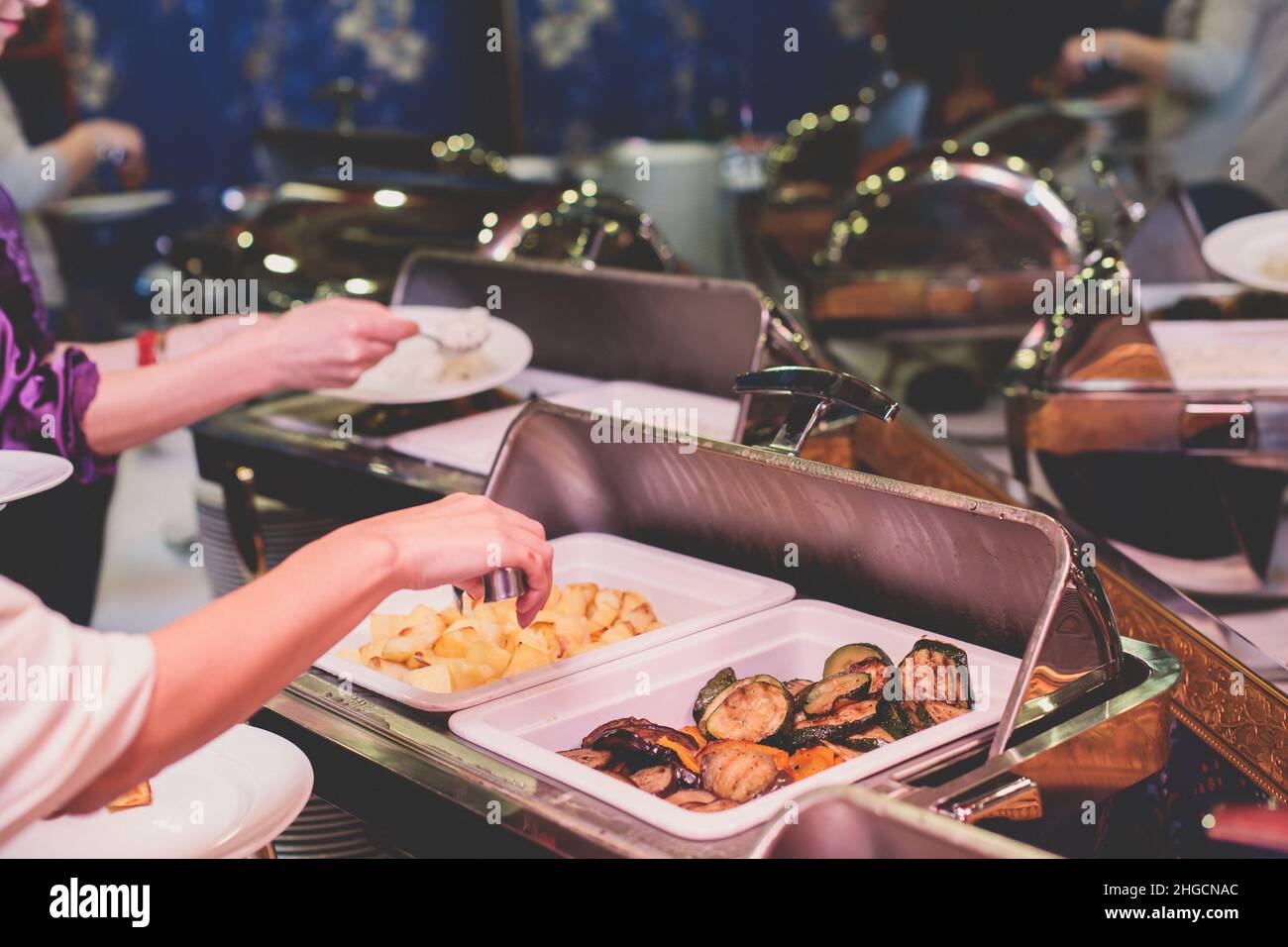 Beautifully decorated catering banquet table with different main course ...