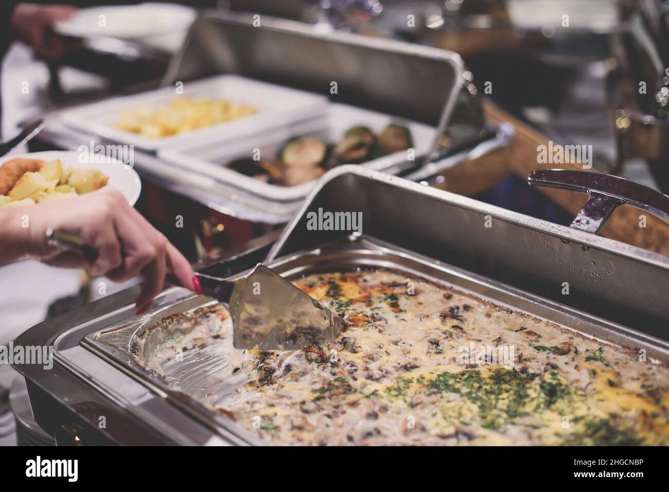 Beautifully decorated catering banquet table with different main course ...