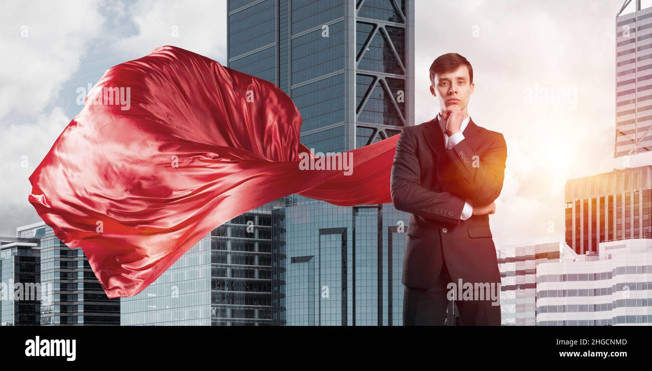Concept of power and sucess with businessman superhero in big city ...