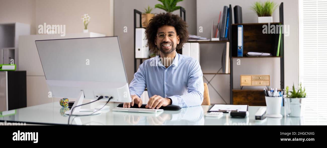Happy Professional Man Employee Using Computer For Work Stock Photo - Alamy