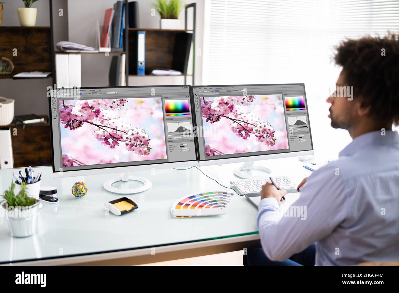 African Graphic Web Designer Using Design Editing Software Stock Photo ...