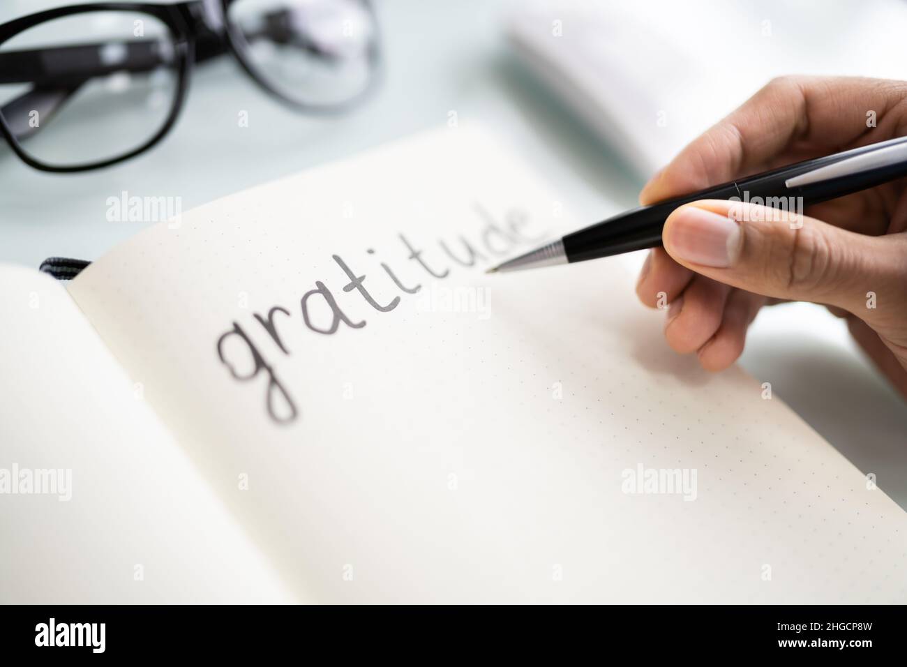 African American Women Writing In Gratitude Journal Stock Photo - Alamy