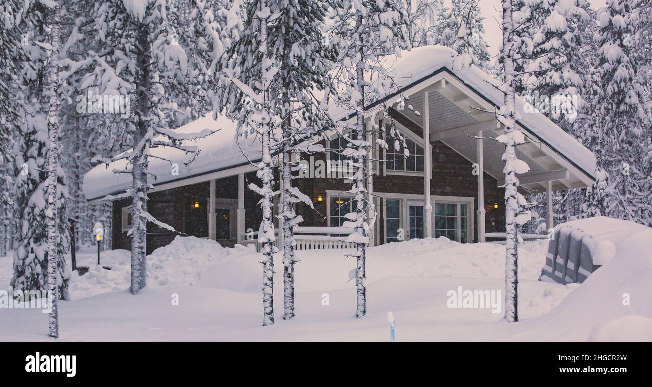 A view of cozy wooden scandinavian cabin cottage chalet house covered ...