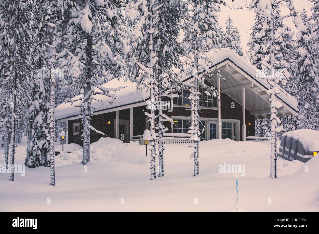 A view of cozy wooden scandinavian cabin cottage chalet house covered ...
