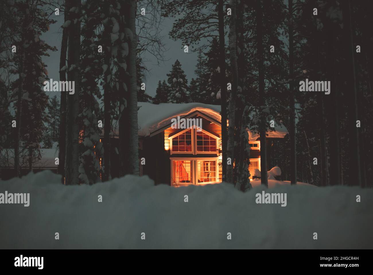 A view of cozy wooden scandinavian cabin cottage chalet house covered ...