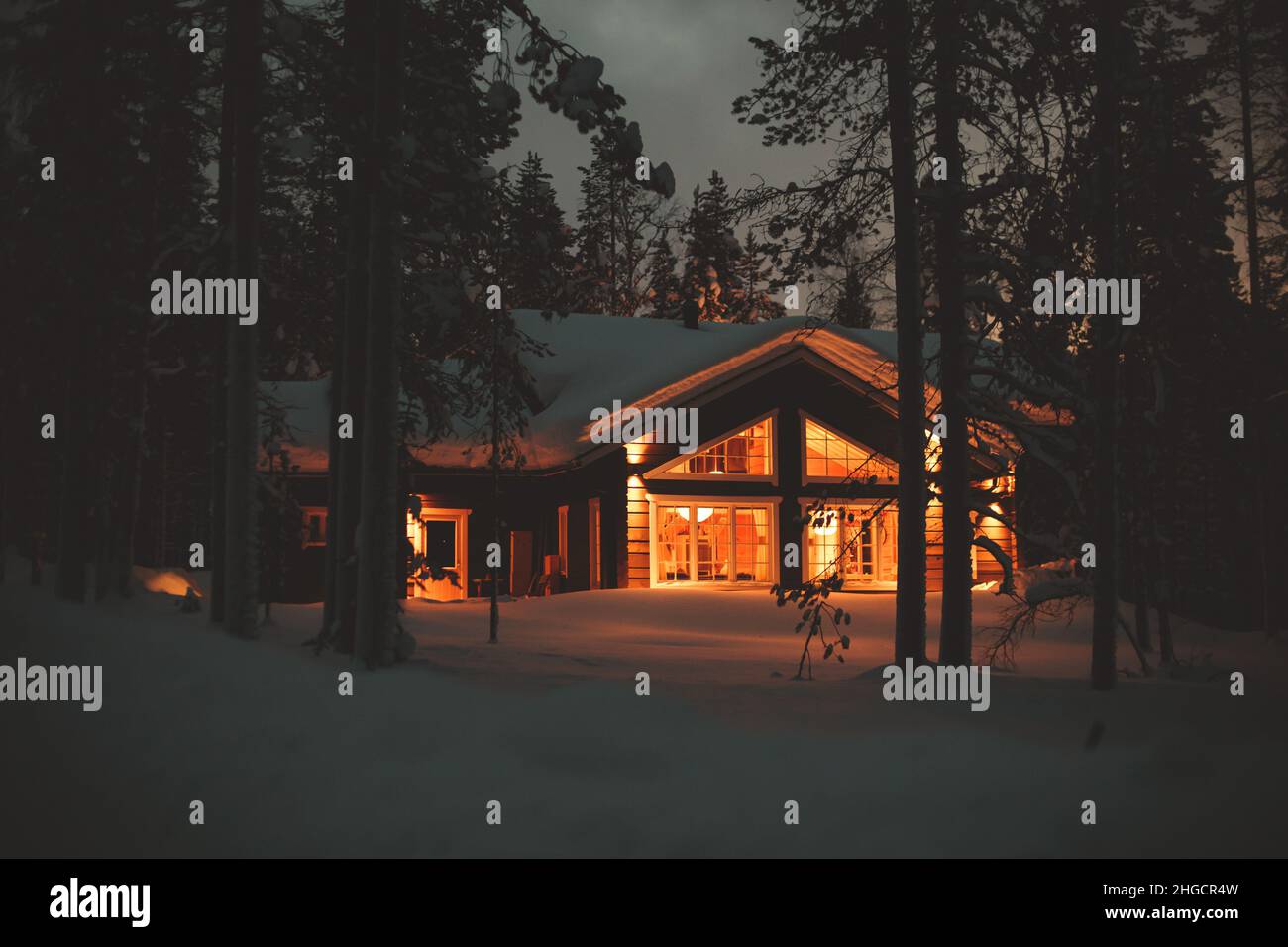 A view of cozy wooden scandinavian cabin cottage chalet house covered ...