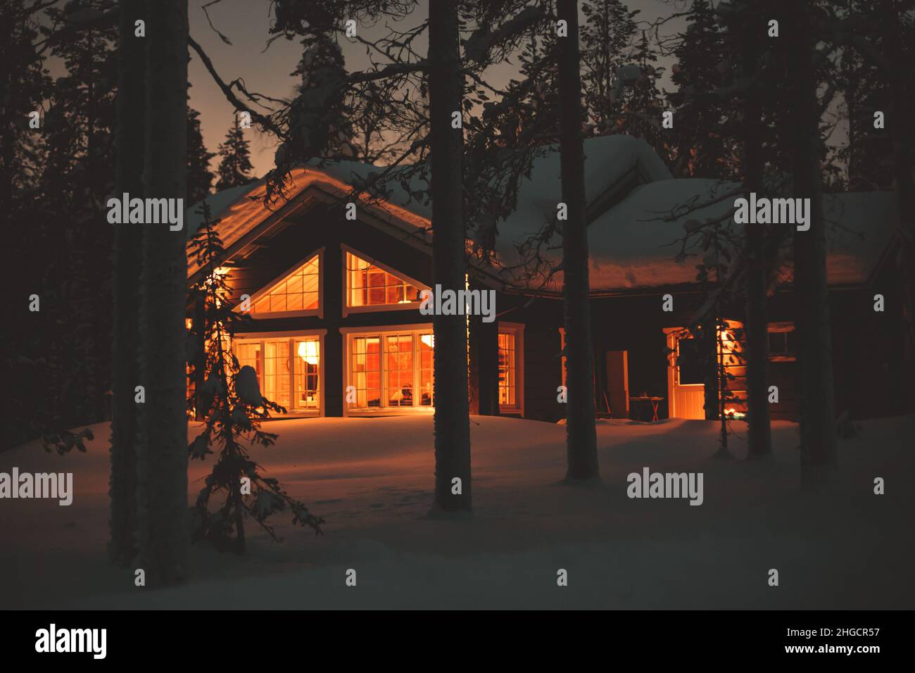 A view of cozy wooden scandinavian cabin cottage chalet house covered ...