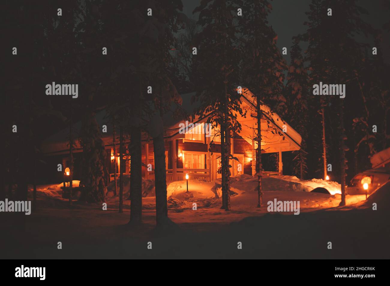A view of cozy wooden scandinavian cabin cottage chalet house covered ...