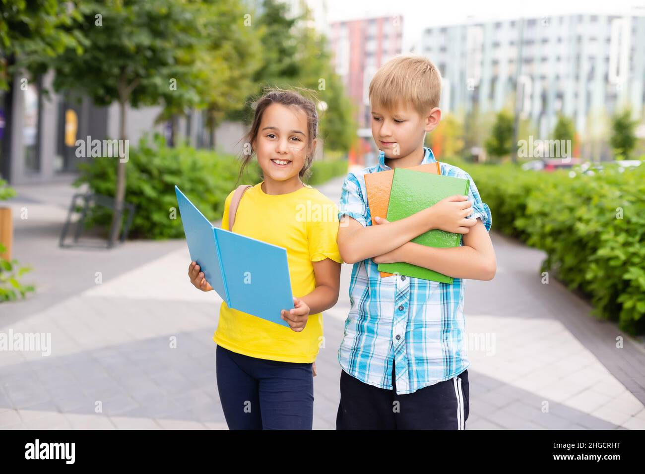 Elementary school kids having fun outdoors Stock Photo - Alamy