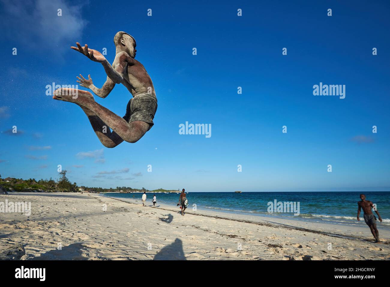 Boy performing action acrobatic jump of African young male Aerial ...