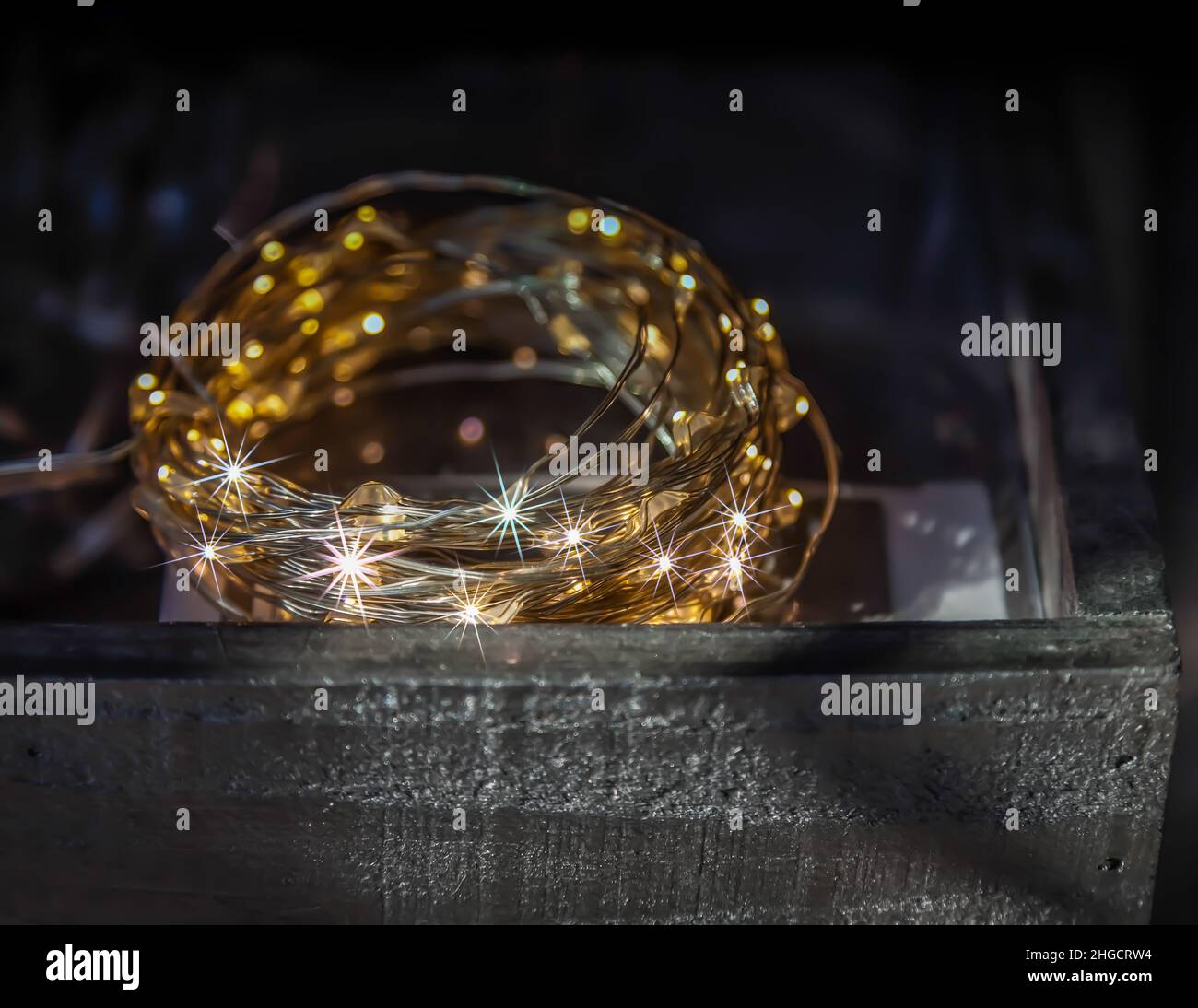 Metal Wire Wreath With Sparkling Lights. Black Background Stock Photo ...