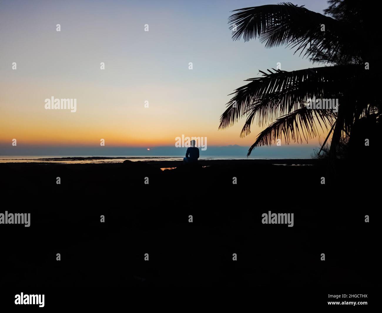 Alone Lonely Boy Sitting On The Beach Stock Photo - Alamy
