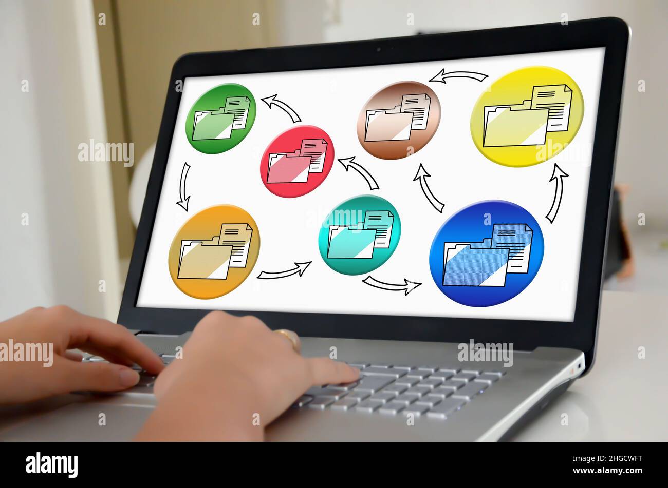 Hands on a laptop with screen showing data transfer concept Stock Photo ...