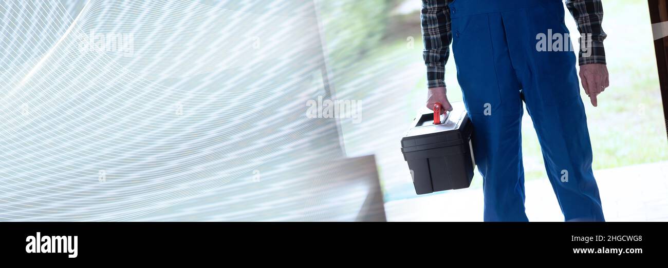 Repairman standing with his toolbox; panoramic banner Stock Photo - Alamy