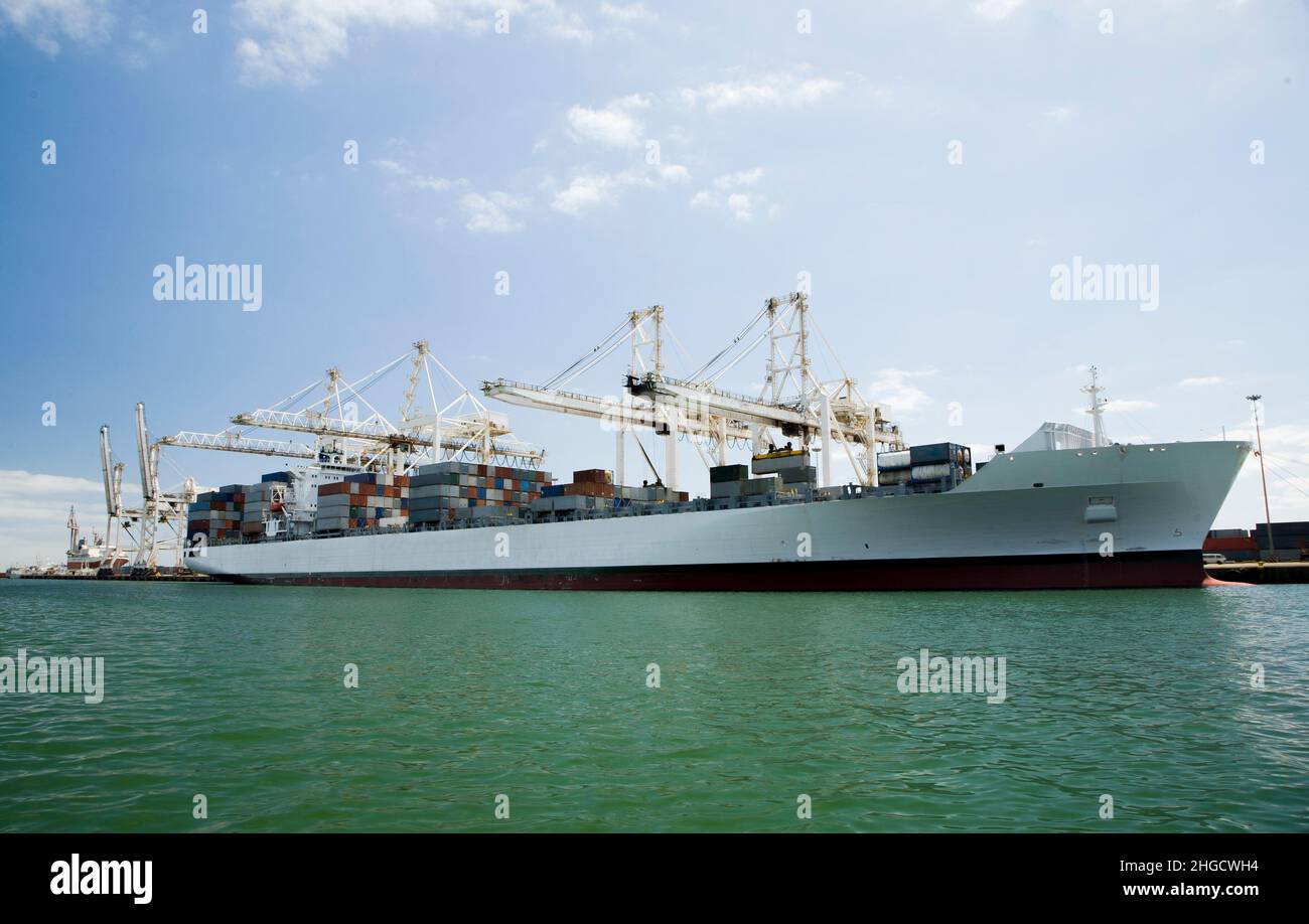 Cargo ship moored in commercial harbor in Cape Town, South Africa ...