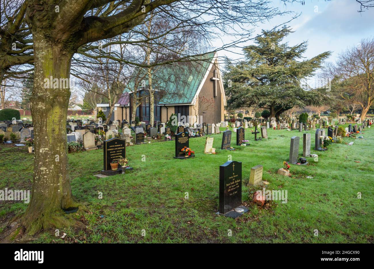 The Chapel, graveyard and gravestones in a large British cemetery at ...