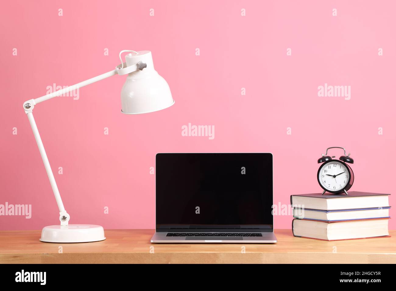 The picture of laptop setting on the desk with color background Stock ...