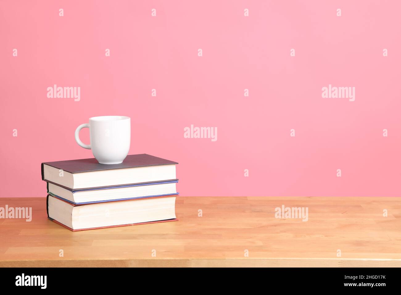 The coffee cup setting on the textbook with color background Stock ...