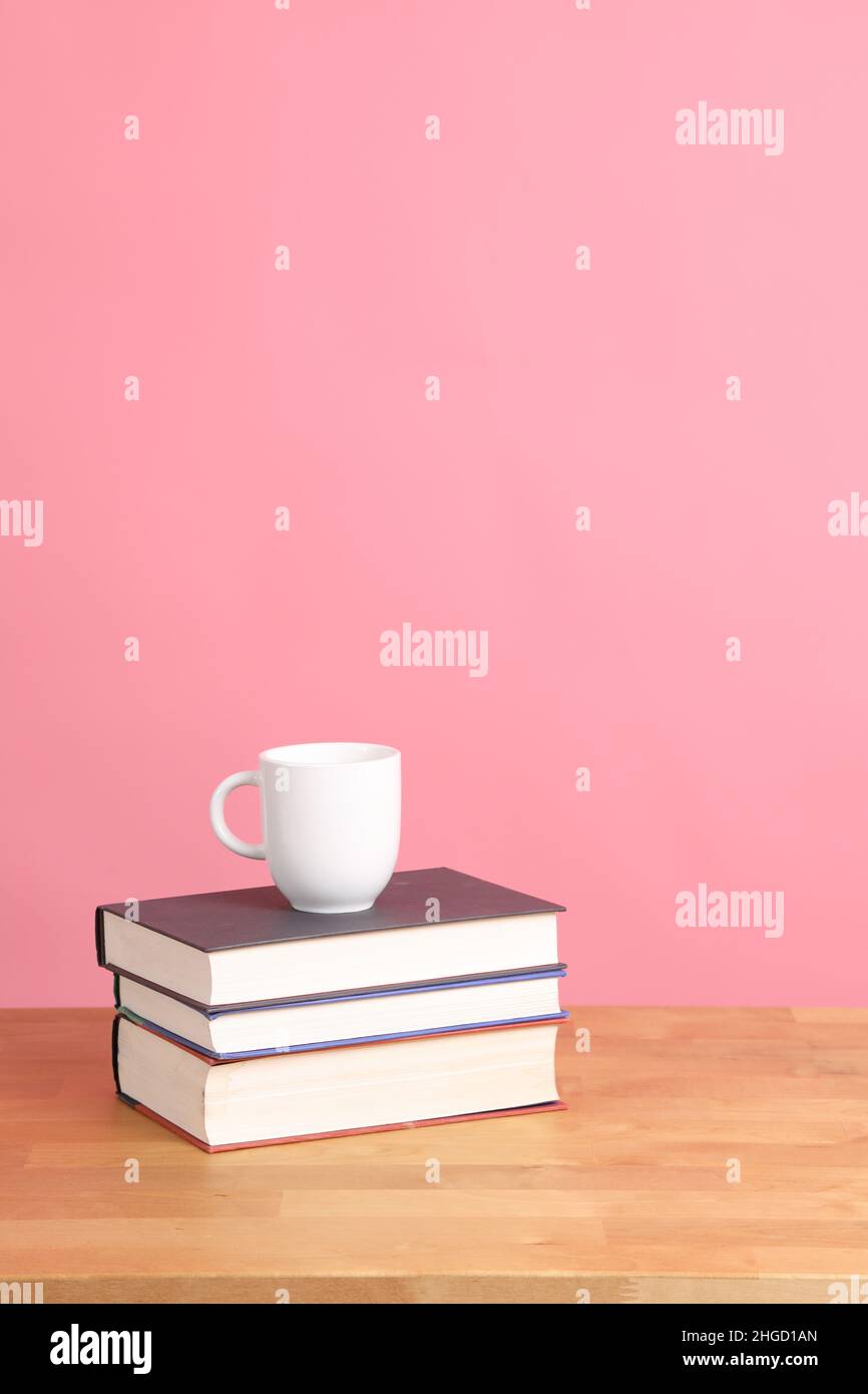 The coffee cup setting on the textbook with color background Stock ...