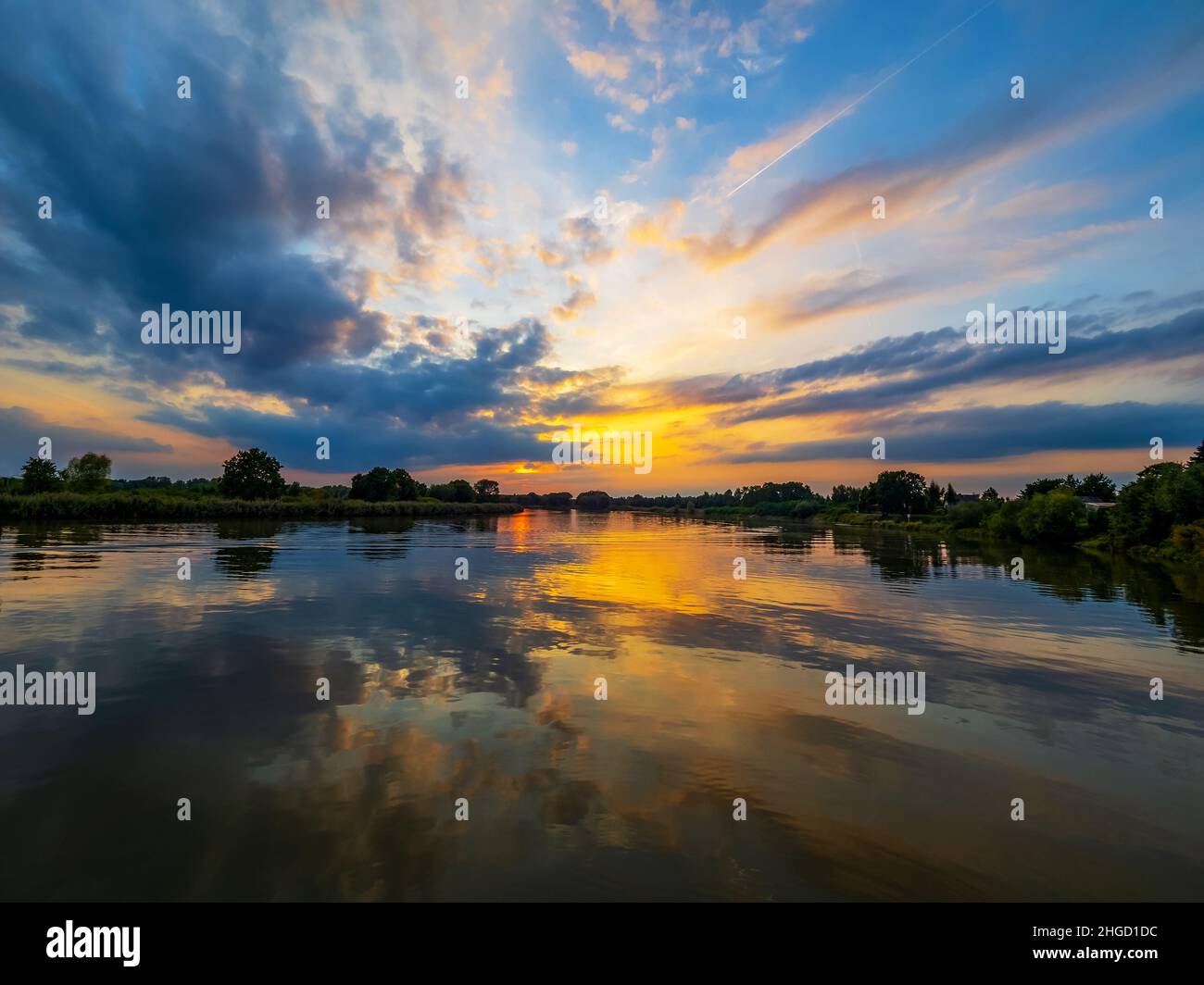 Evening sky with dramatic clouds over the river. Dramatic sunset in ...