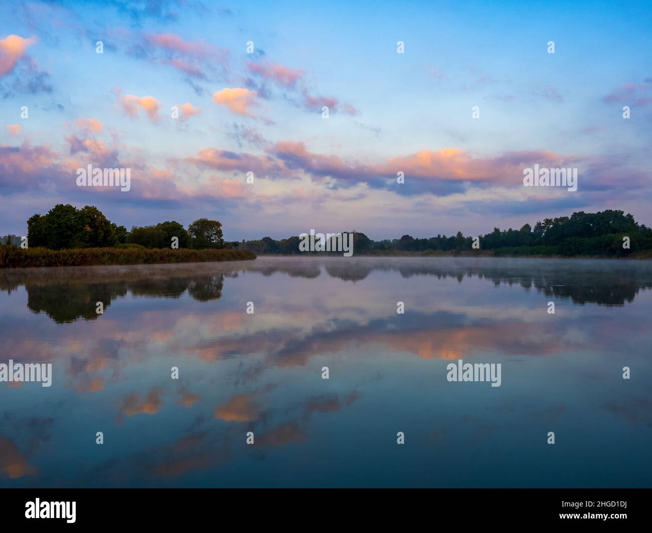 Morning sky with clouds over the river. Beautiful sunrise and ...
