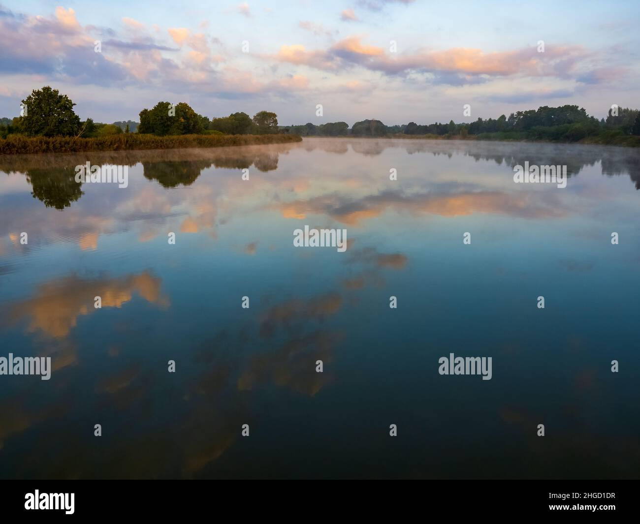 Morning sky with clouds over the river. Beautiful sunrise and ...