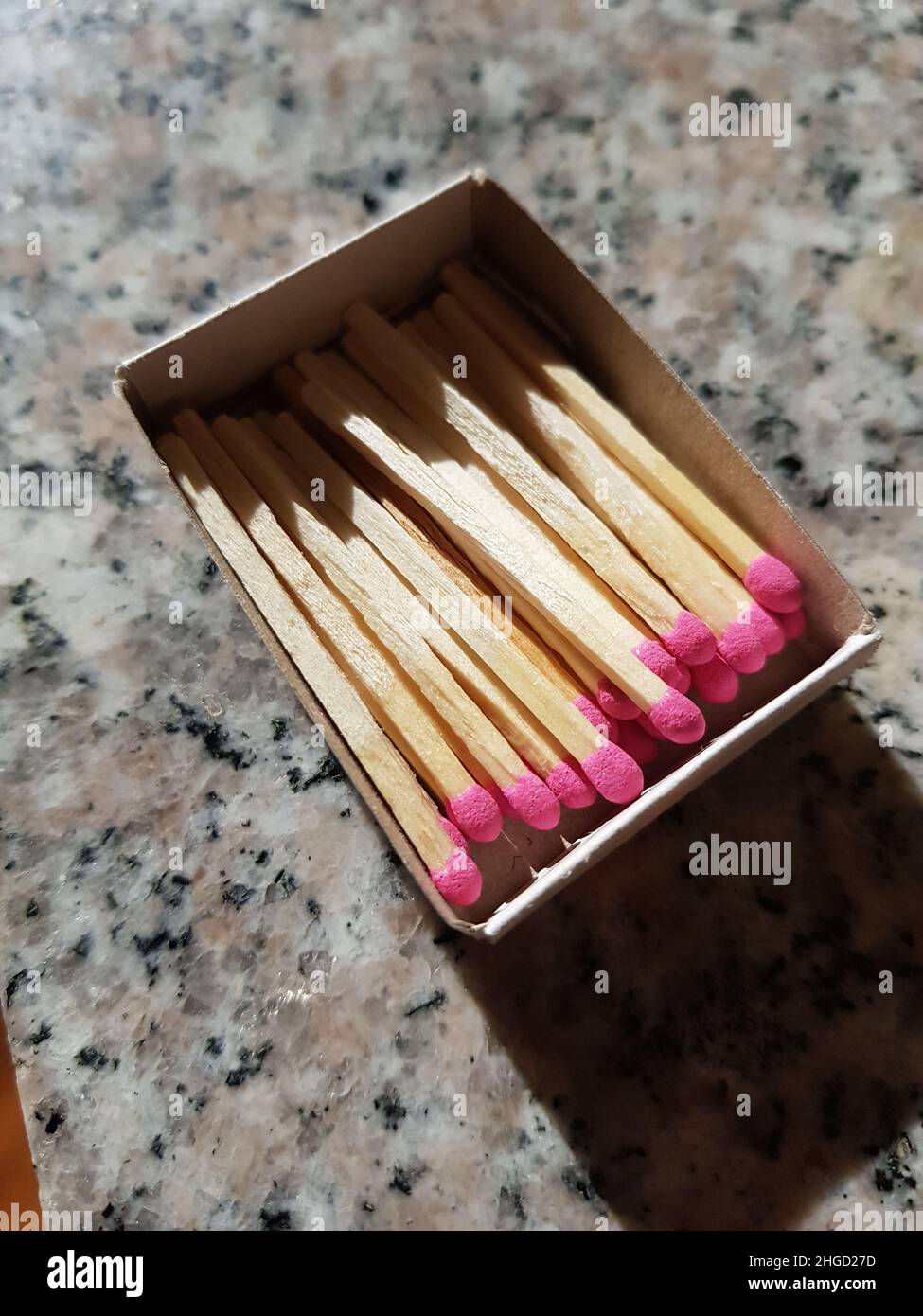 Cardboard box with pink matches on a grey granite table Stock Photo - Alamy