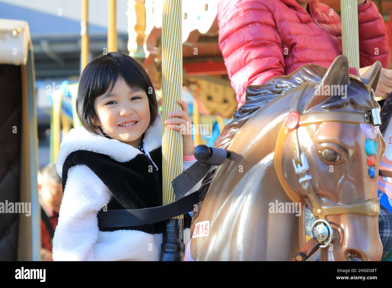 Child merry go round hi-res stock photography and images - Alamy