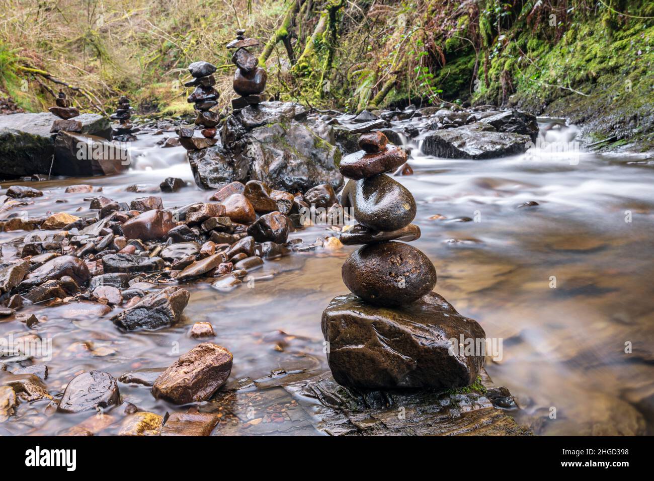 Stone stacking or rock balancing at river. Zen balanced pebbles stack ...