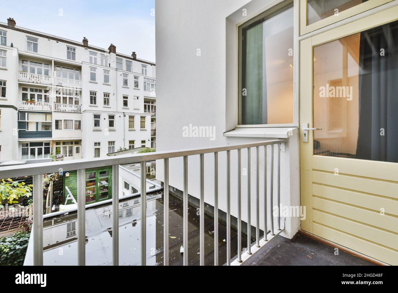 A small cozy balcony with a view of a residential building Stock Photo ...
