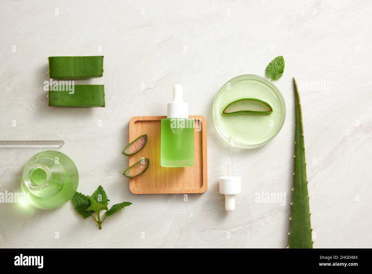 Aloe vera extract research in laboratory with a dish dropper in white ...