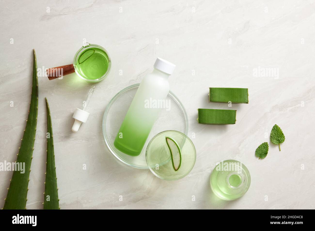 Aloe vera extract research in laboratory with a dish dropper in white ...