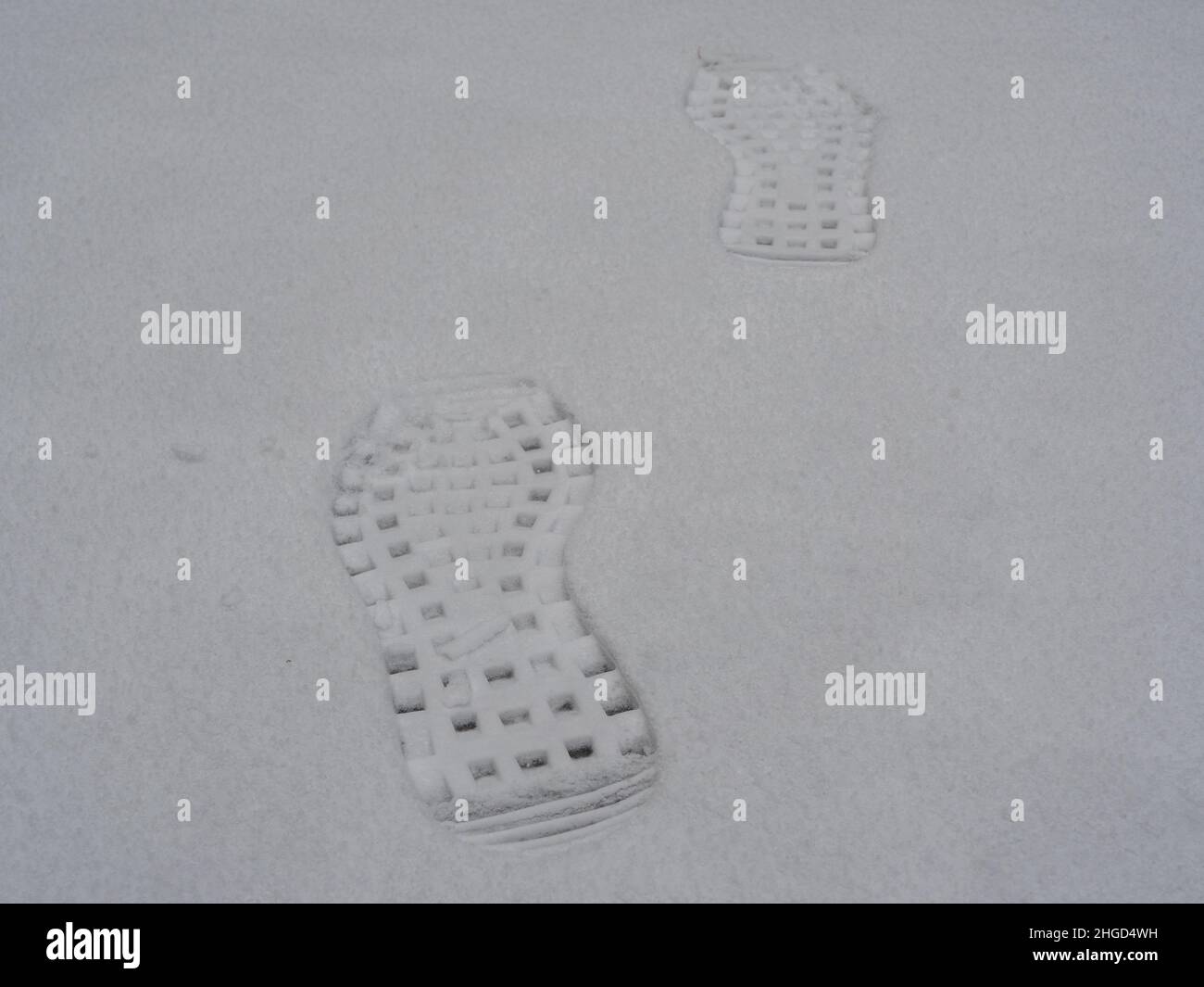 footprint in snow background texture Stock Photo - Alamy