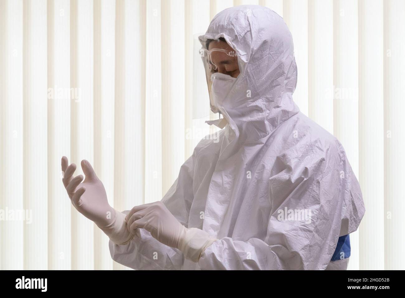 doctor wearing ppe suit and facemask perform coronavirus covid-19 PCR ...