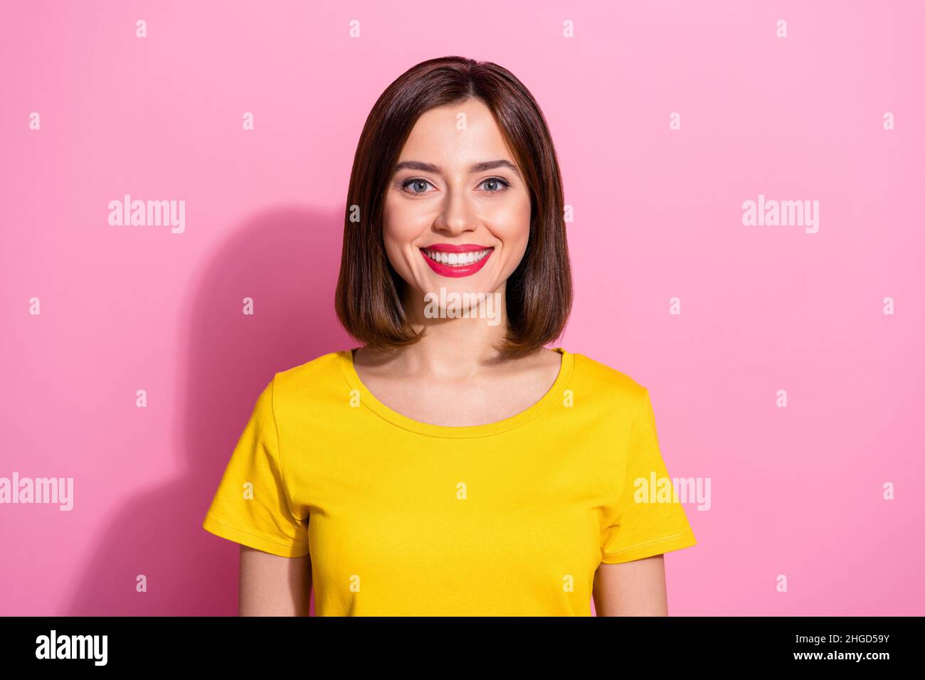 Photo of brunette cool young lady wear yellow t-shirt isolated on ...