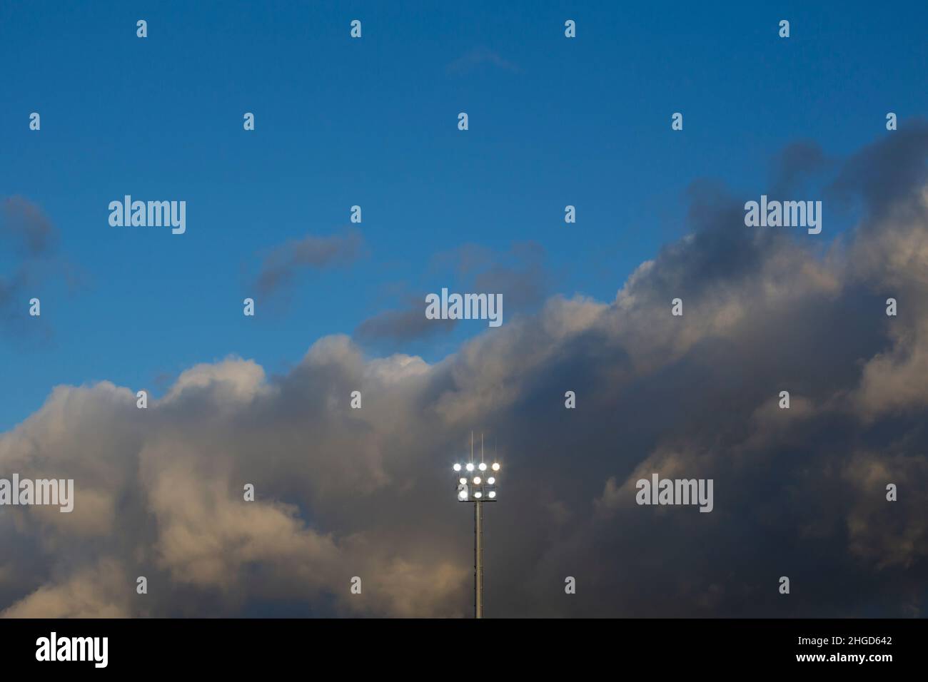 Lighting of a soccer field with storm clouds in the background Stock ...