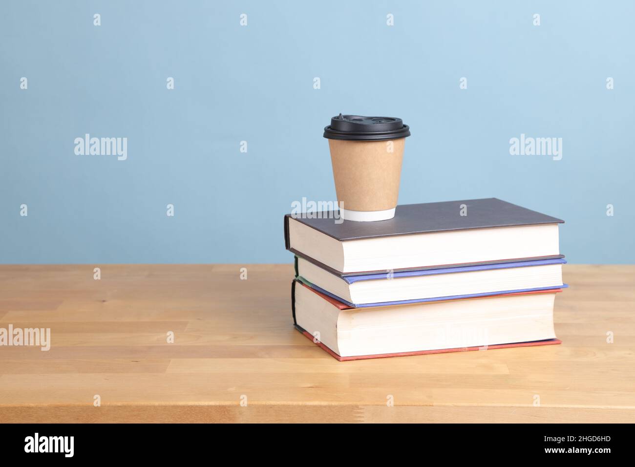 The coffee cup setting on the textbook with color background Stock ...
