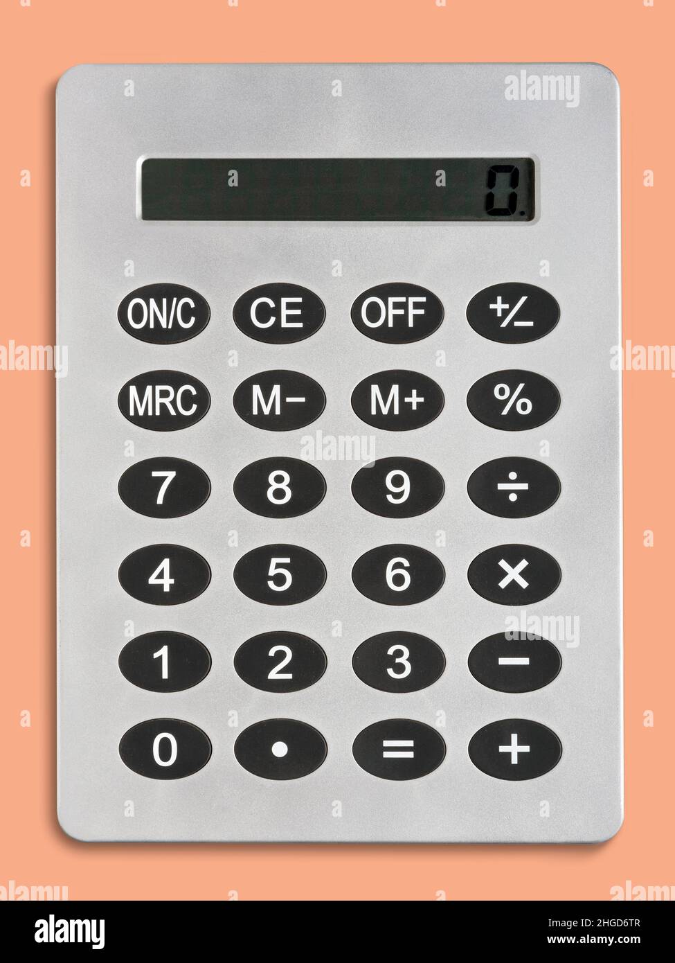 Top view of plain gray calculating machine with black buttons and ...