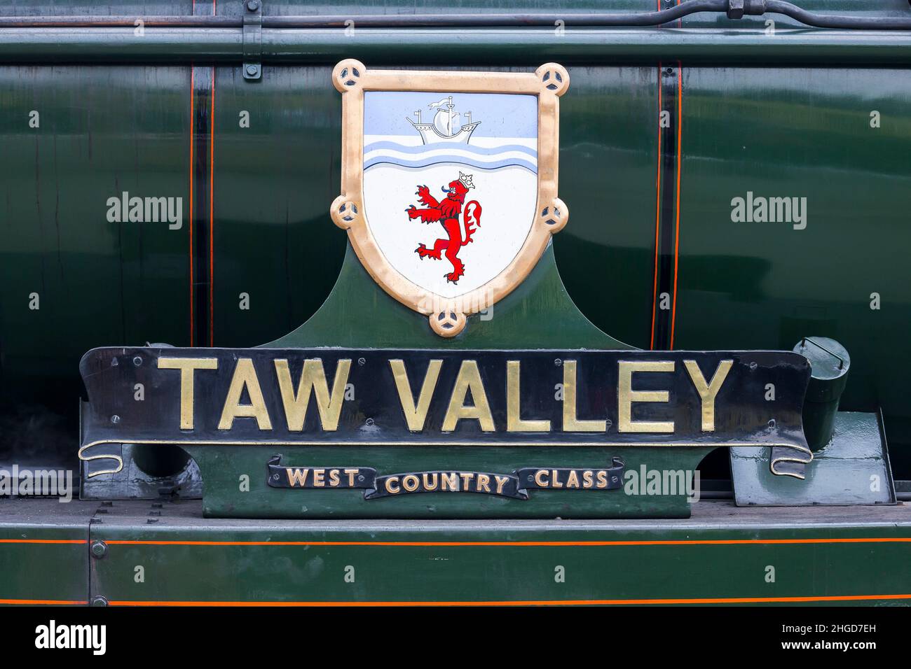 Isolated nameplate of vintage, UK steam locomotive Taw Valley in green ...