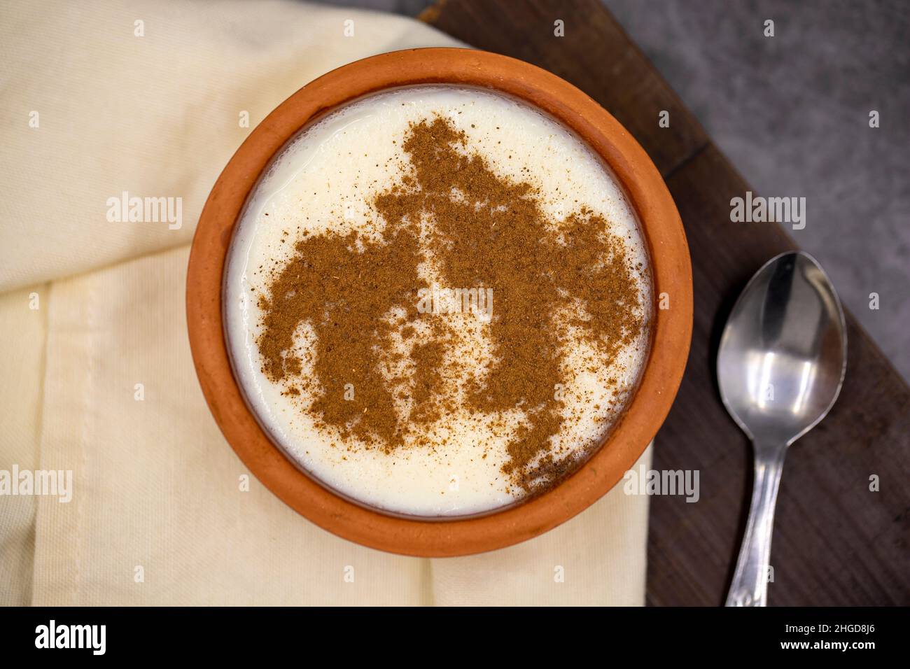 Rice pudding (Sutlac). Turkish cuisine flavor rice pudding on a dark ...