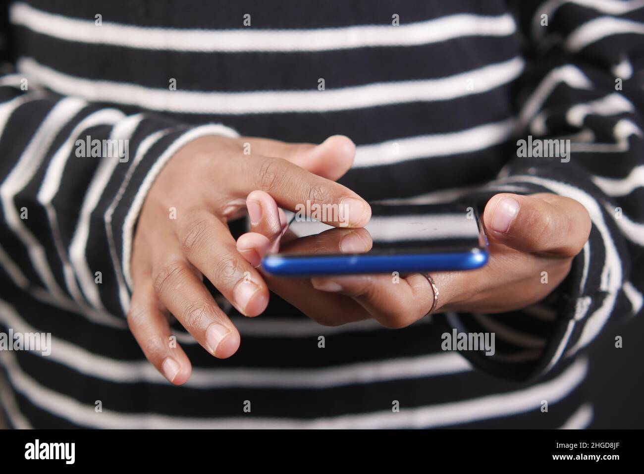child hand pointing finger on smart phone screen Stock Photo - Alamy