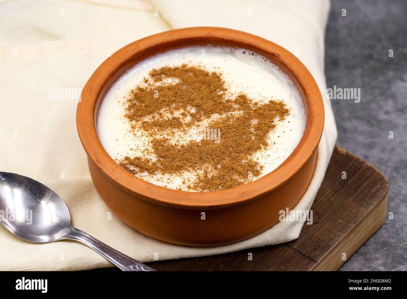 Rice pudding (Sutlac). Turkish cuisine flavor rice pudding on a dark ...